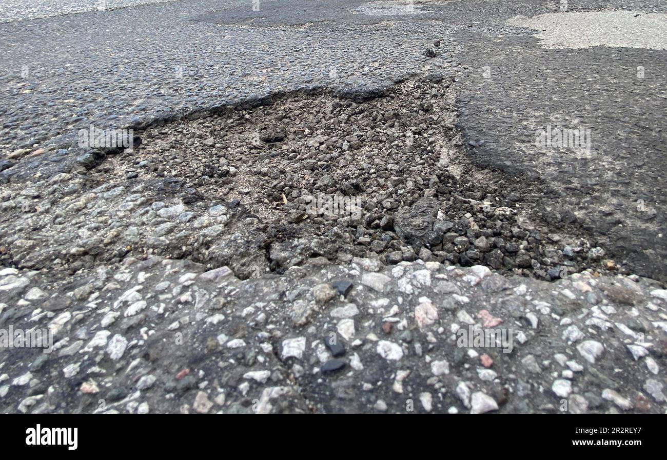 Hamburg, Germany. 19th May, 2023. A pothole is seen on a street in the ...