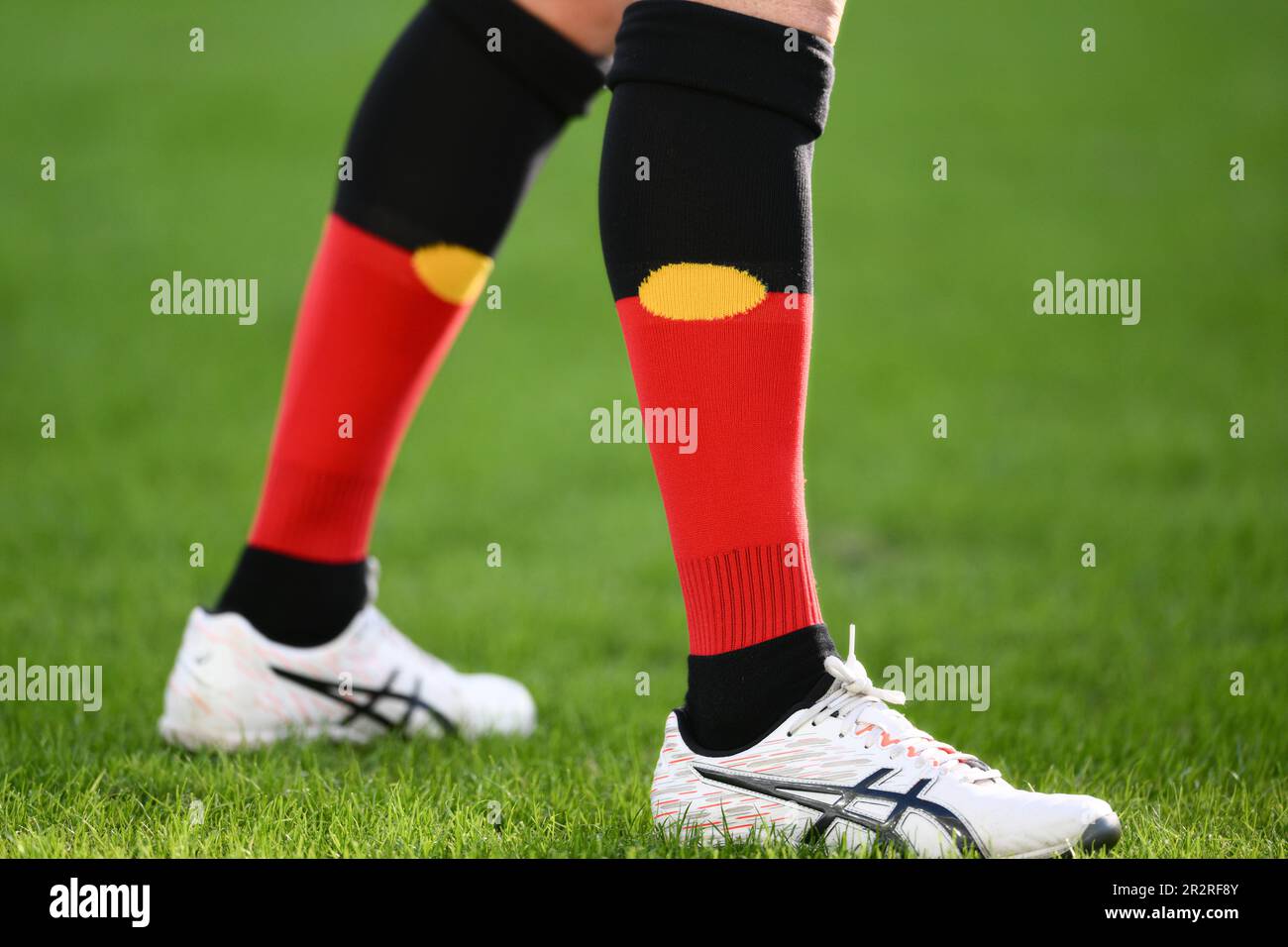 The Touch Judge wearing socks with an indigenous flag design during the ...