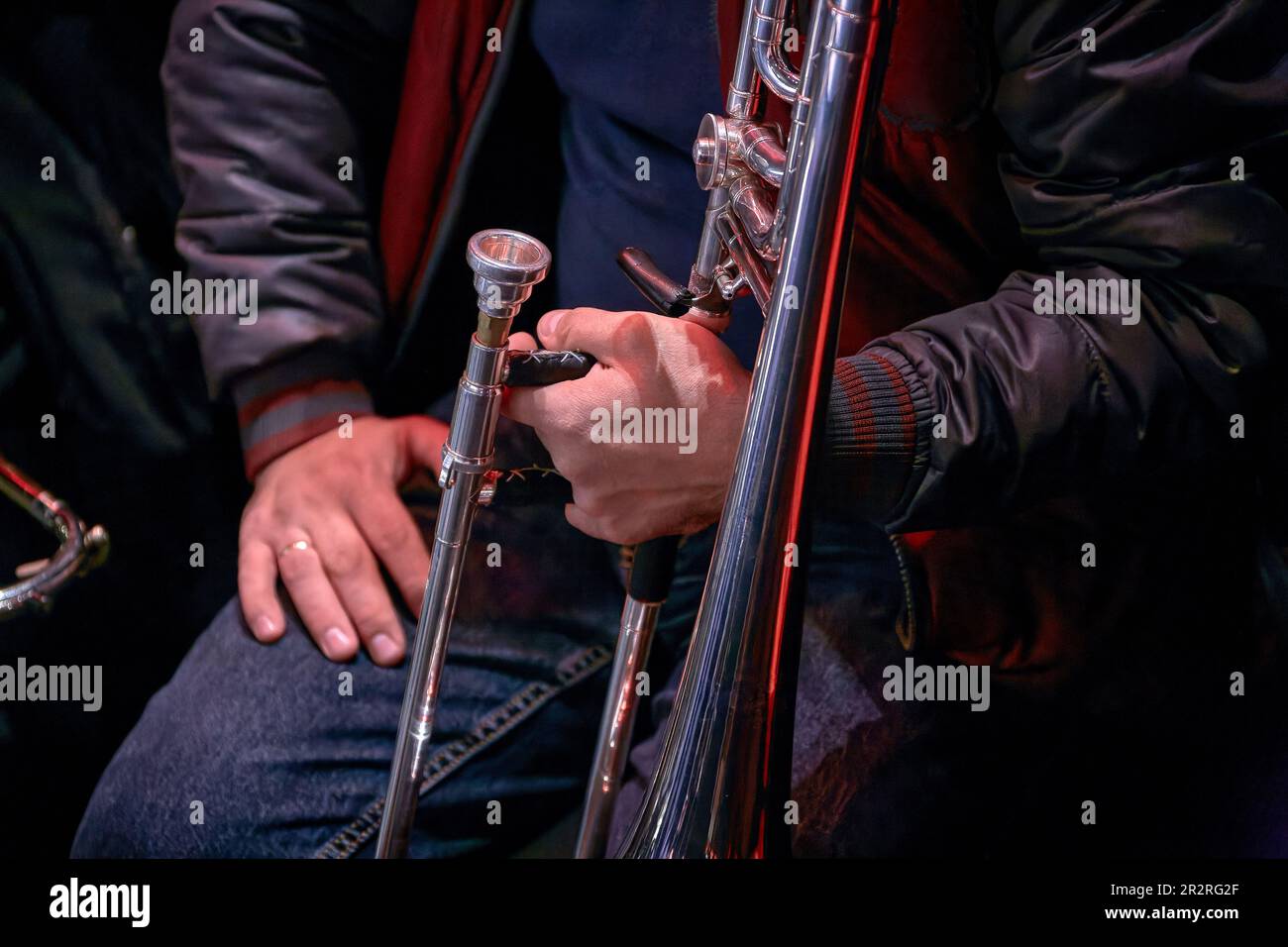 Image of musician trombonist holding his trombone Stock Photo - Alamy