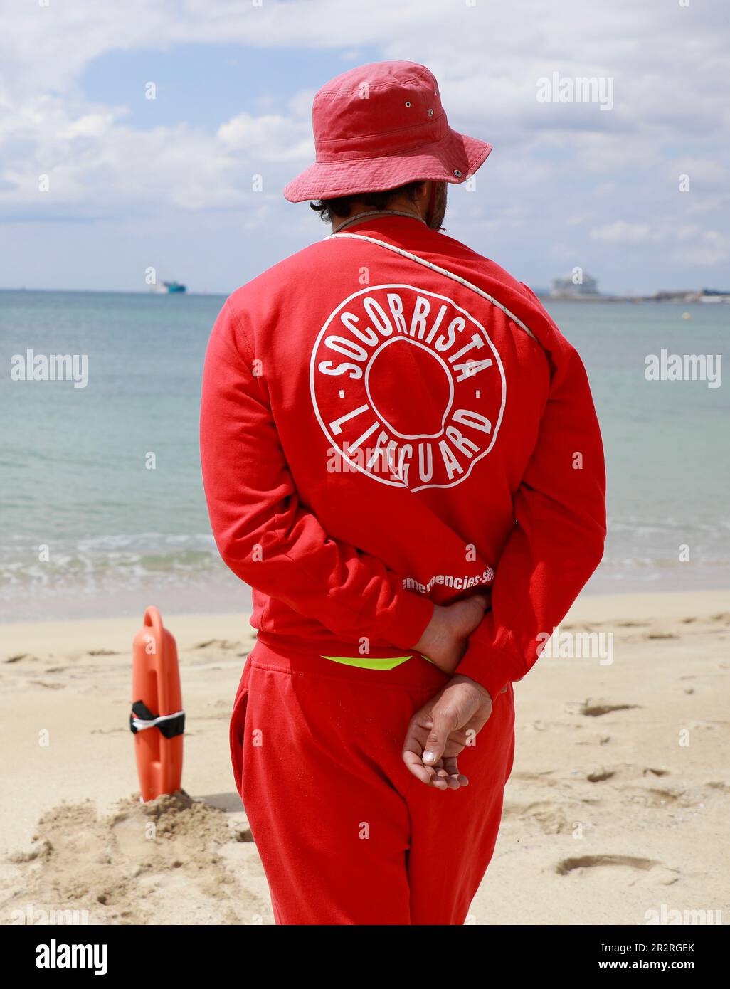 Palma, Spain. 20th May, 2023. Nacho, a lifeguard, stands on the beach ...