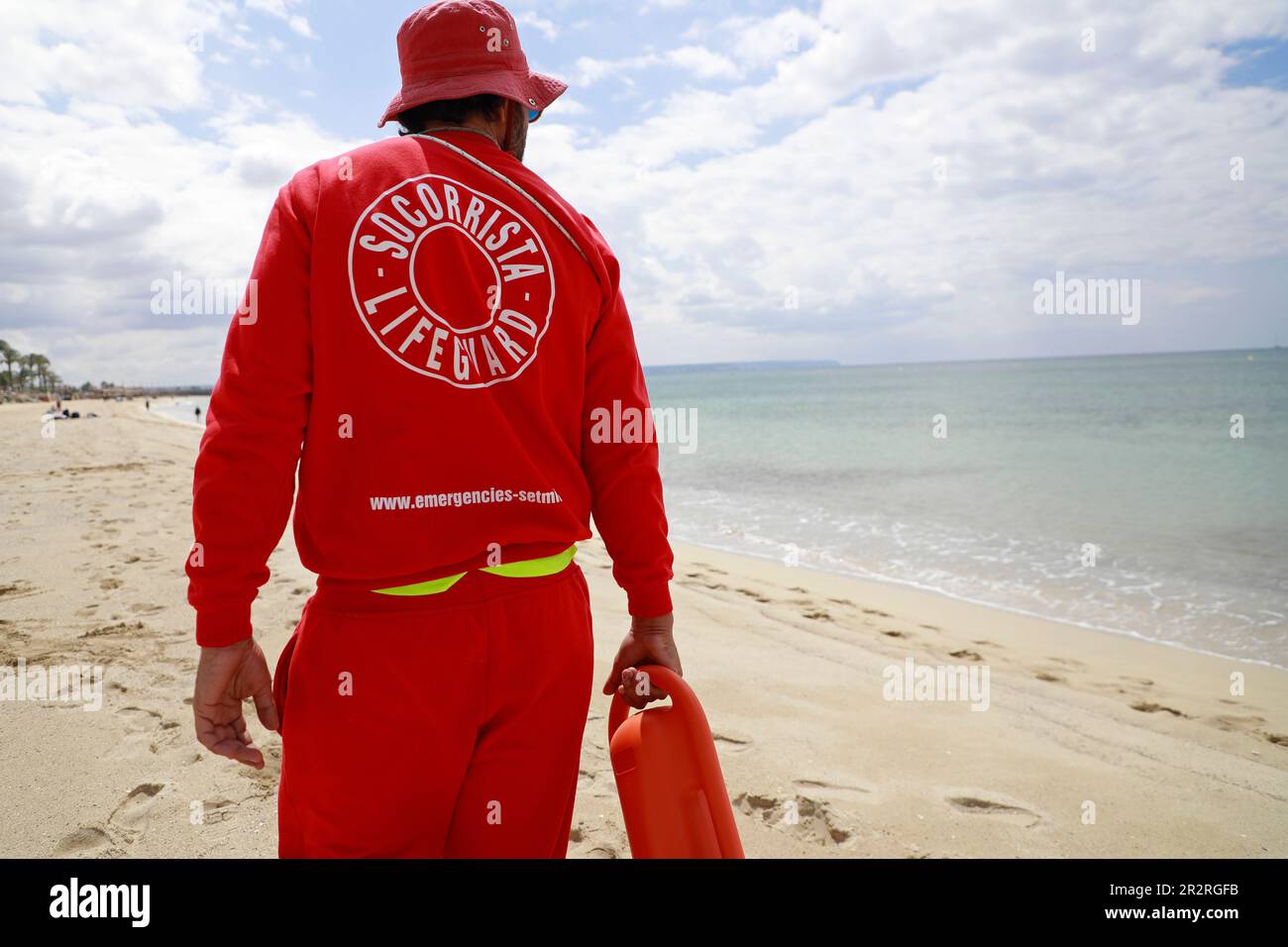 Palma, Spain. 20th May, 2023. Nacho, a lifeguard, stands on the beach ...