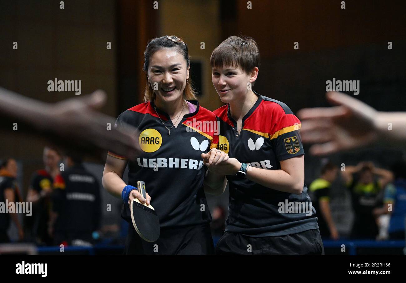Durban, South Africa. 20th May, 2023. Nina Mittelham (R)/Shan Xiaona of Germany react after ...