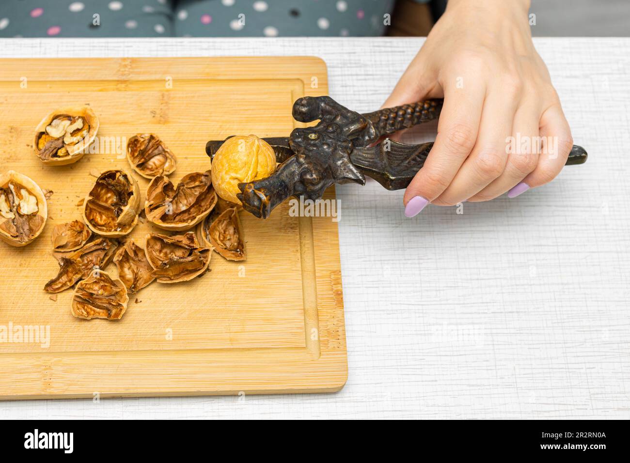 Hand cracking nuts hi-res stock photography and images - Alamy