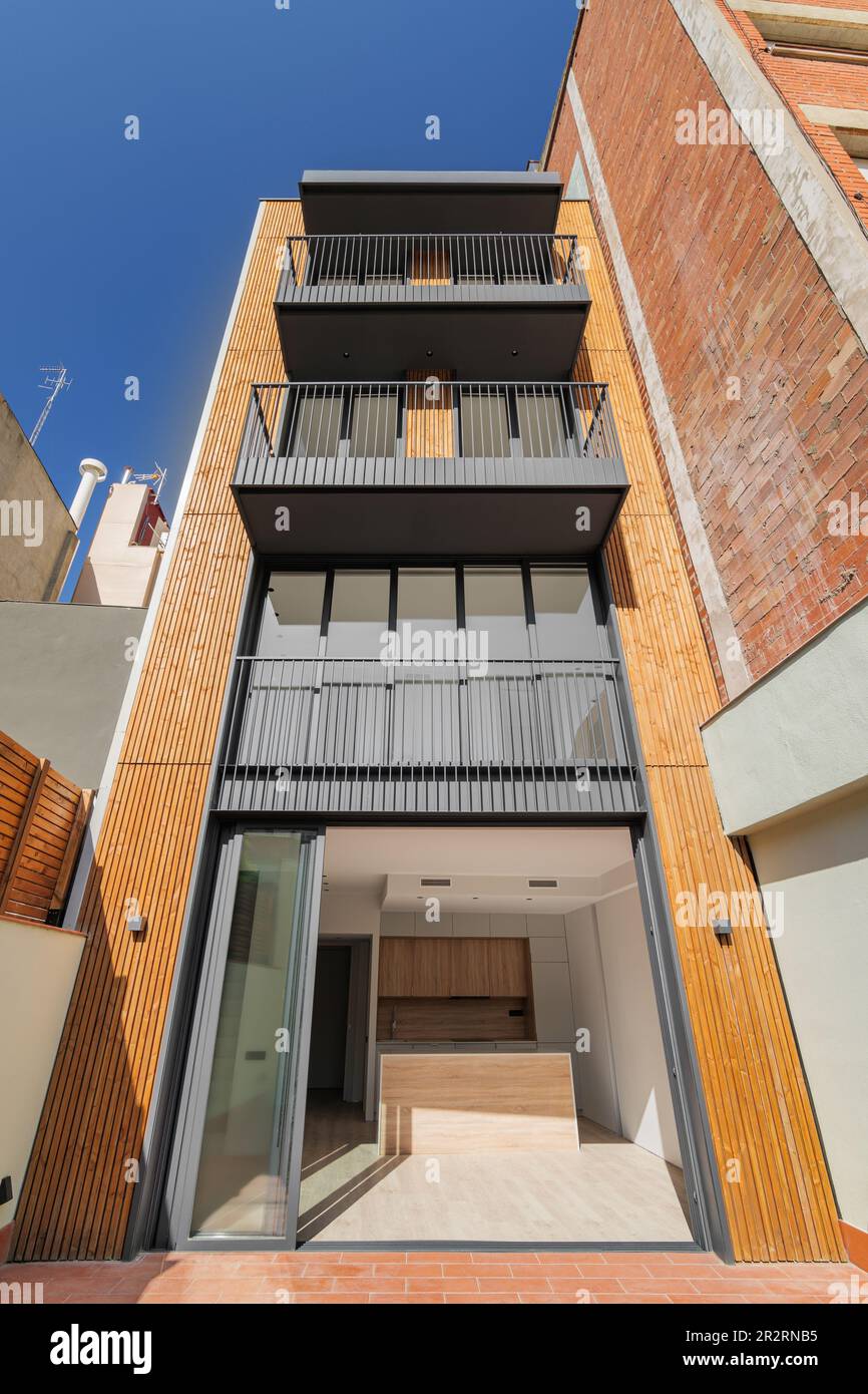 Frontal view of wooden and metal contemporary building facade with ...