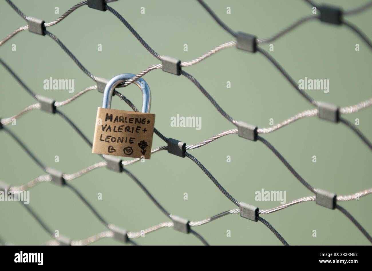 Love lock hanging on a bridge fence. Concept of friendship love and ...