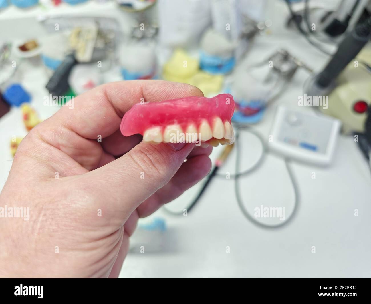 Wax dentures model table of dental technician workplace Stock Photo - Alamy