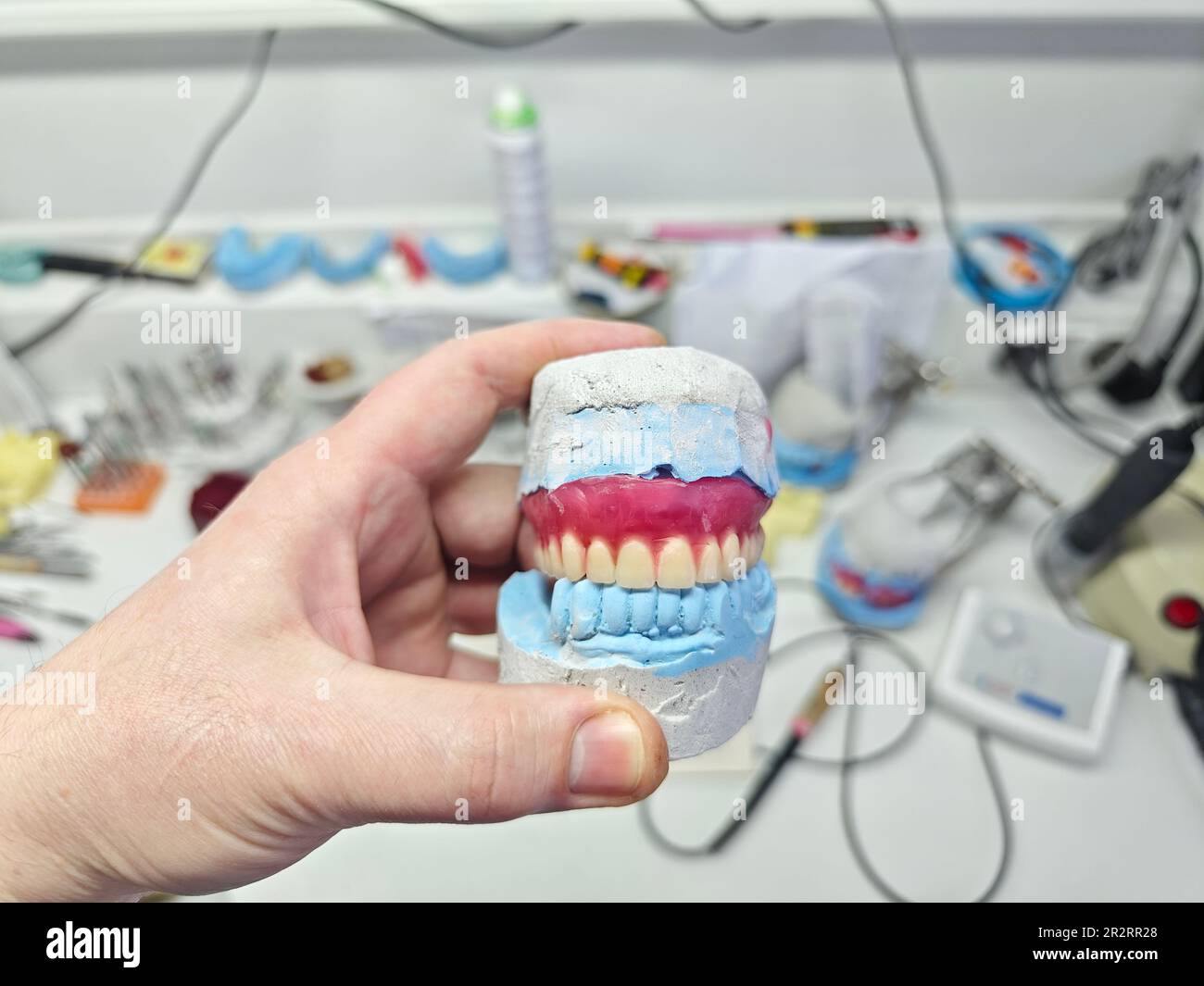 Wax dentures model table of dental technician workplace Stock Photo - Alamy