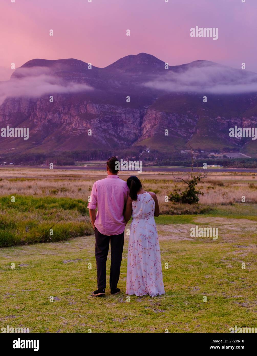 A couple man and women mid age in front of their lodge during a ...