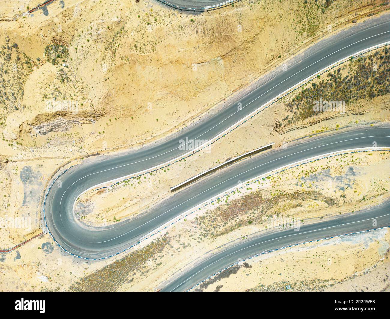 Top aerial view of snake curved road. Winding mountains road. View from ...
