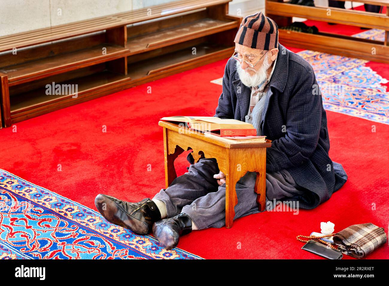 Istanbul Turkey. Muslim believer praying and reading Koran in the Fatih ...