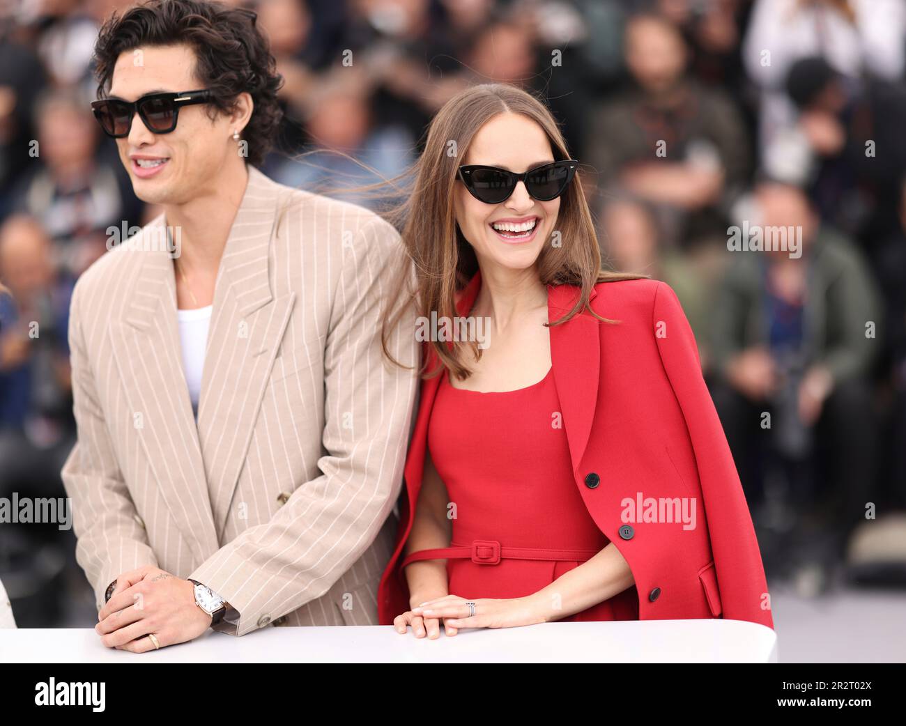Charles Melton, left, and Natalie Portman pose for photographers at the ...