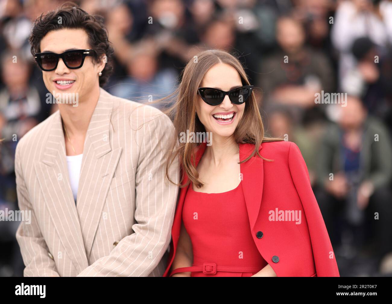 Charles Melton, left, and Natalie Portman pose for photographers at the ...