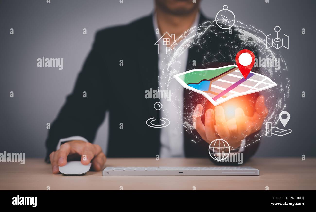 Businessman hand holding virtual world and model map with location ...