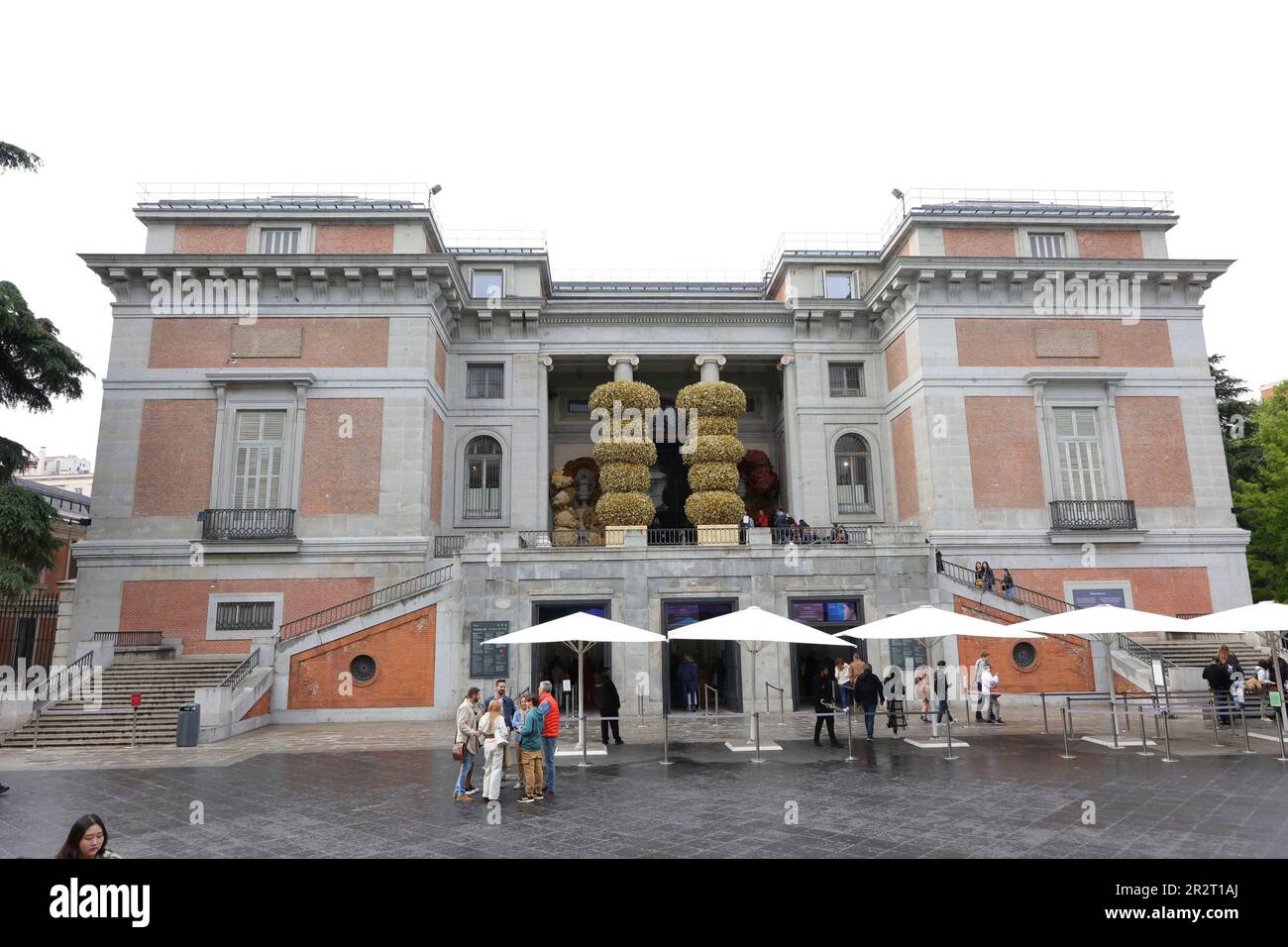 Several people wait to enter the Museo Nacional del Prado, which has ...