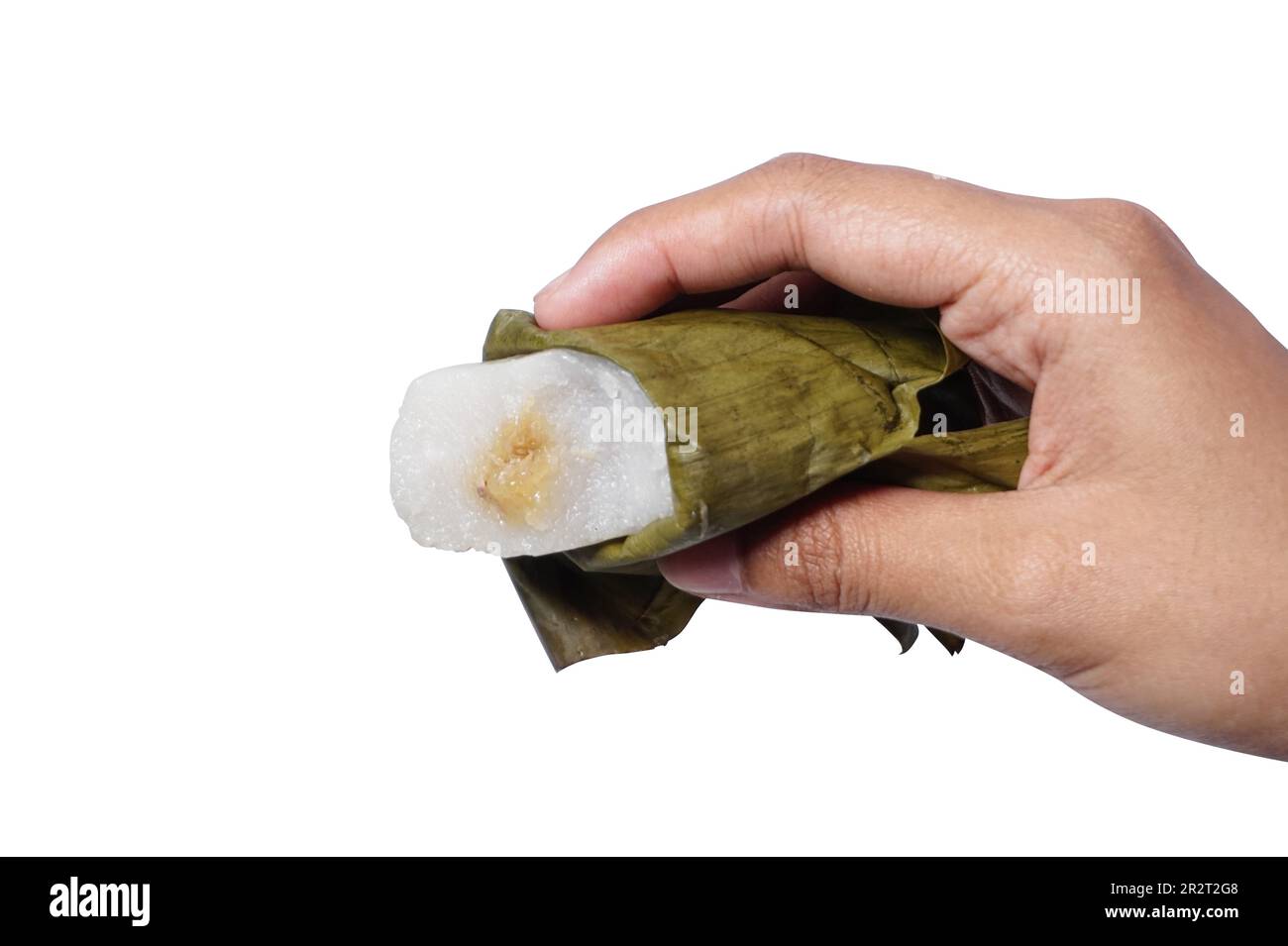 Hand holding nagasari cake. Nagasari is a traditional cake from ...