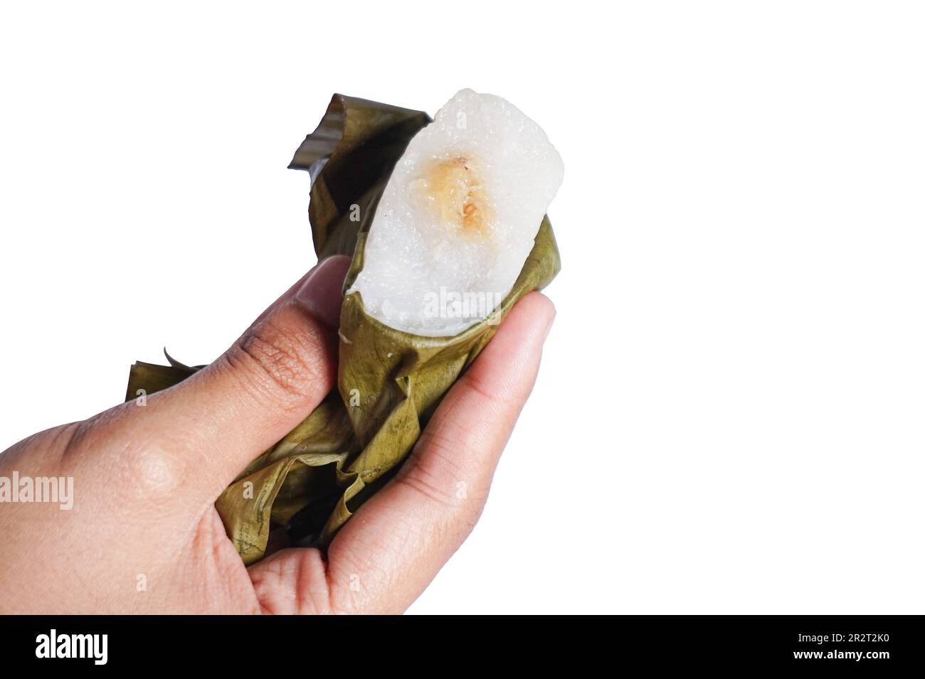 Hand holding nagasari cake. Nagasari is a traditional cake from ...