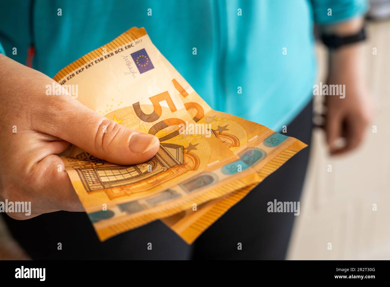 Euro money, Woman holds european union banknotes in hand, Cash means of ...
