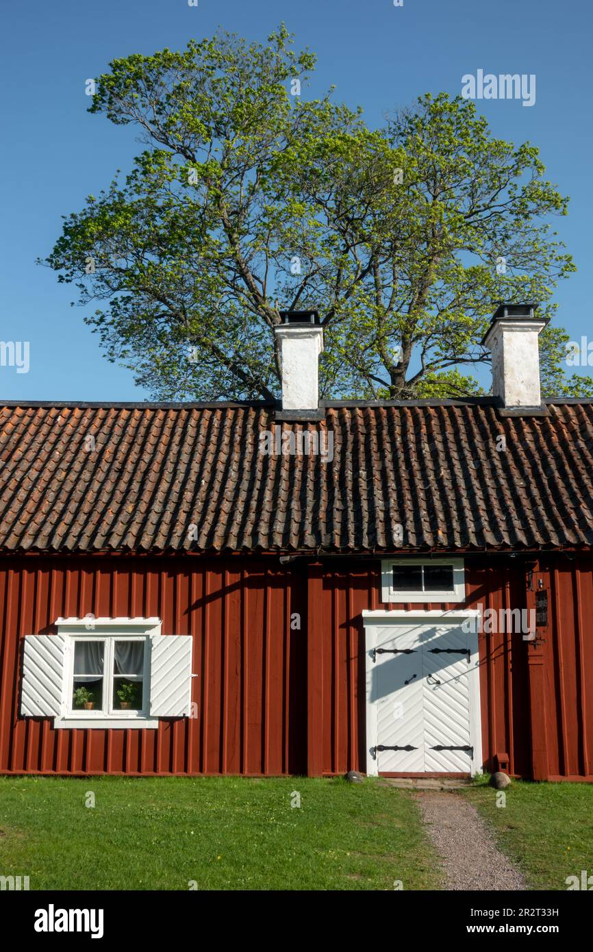 Picturesque traditional red painted Scandinavian farmhouse with white ...