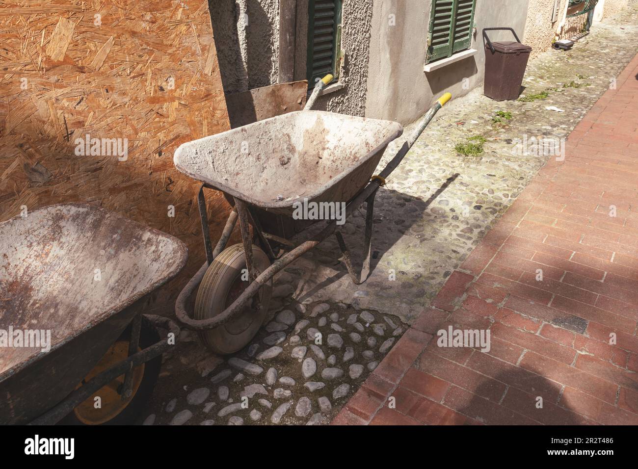 Empty wheelbarrows abadoned on the street Stock Photo - Alamy