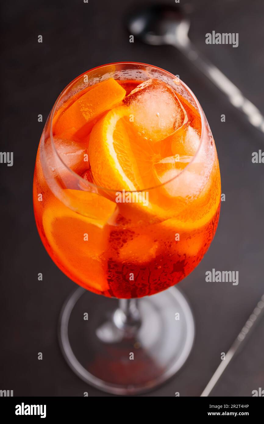 Classic italian aperitif Aperol Spritz cocktail with slice of orange on ...