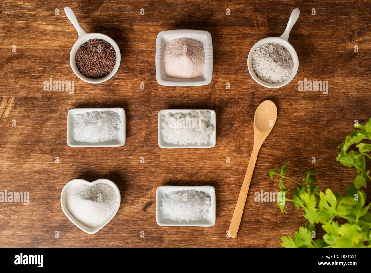 Small jars with different types of salt, black and pink from the ...