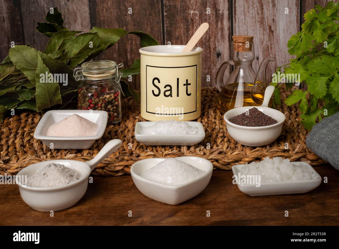 Salt jar together with small dishes with different types of salt, black ...