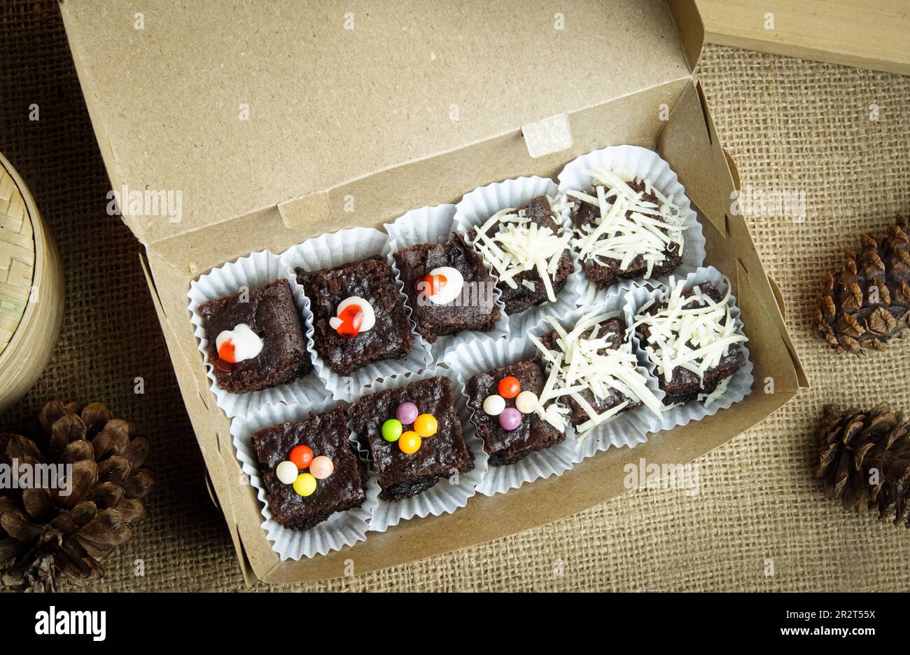 Chocolate brownies in a box with various toppings Stock Photo - Alamy