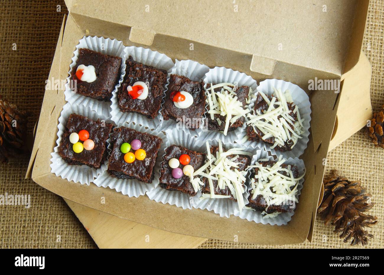 Chocolate brownies in a box with various toppings Stock Photo - Alamy