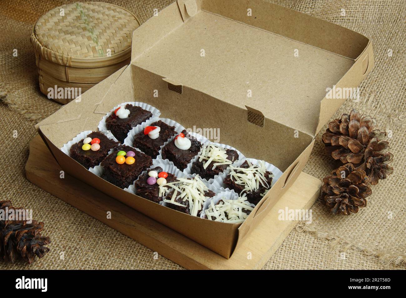 Chocolate brownies in a box with various toppings Stock Photo - Alamy