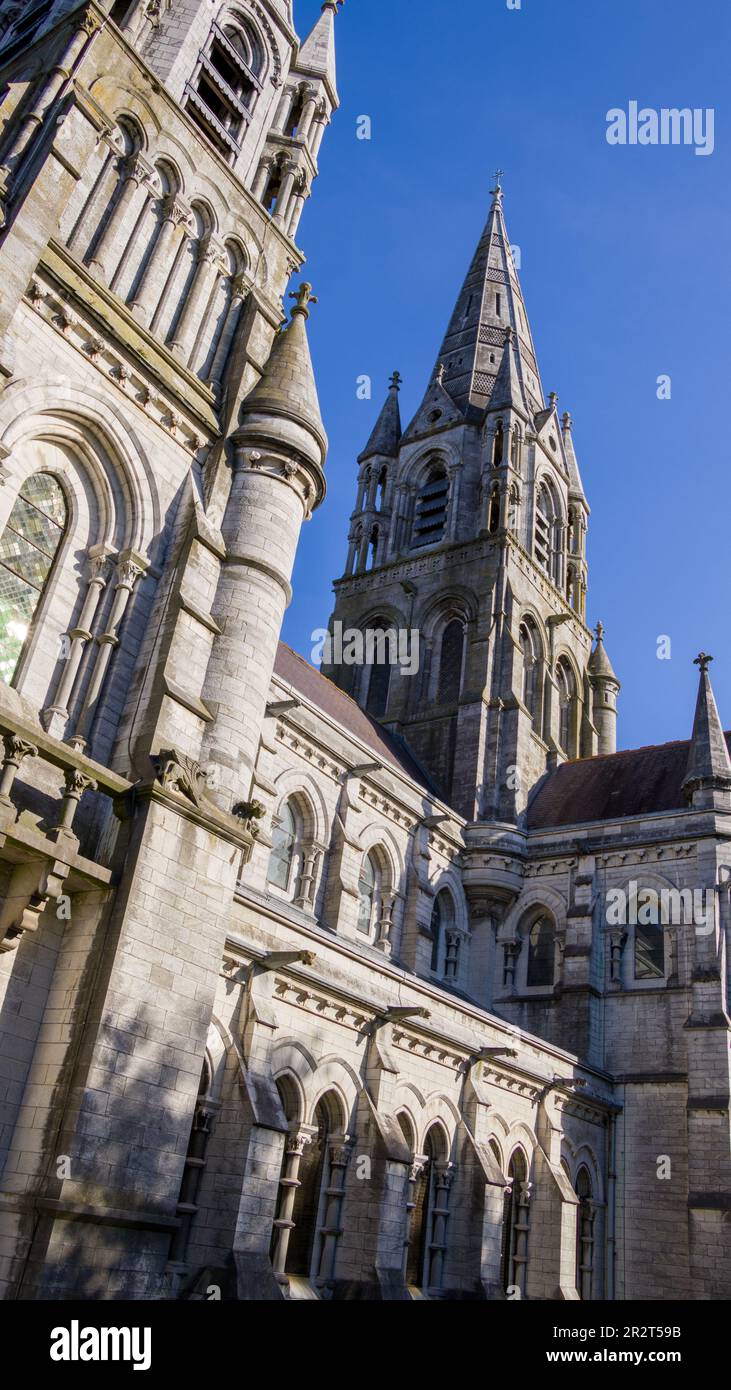The tall Gothic spire of an Anglican church in Cork, Ireland. Neo ...