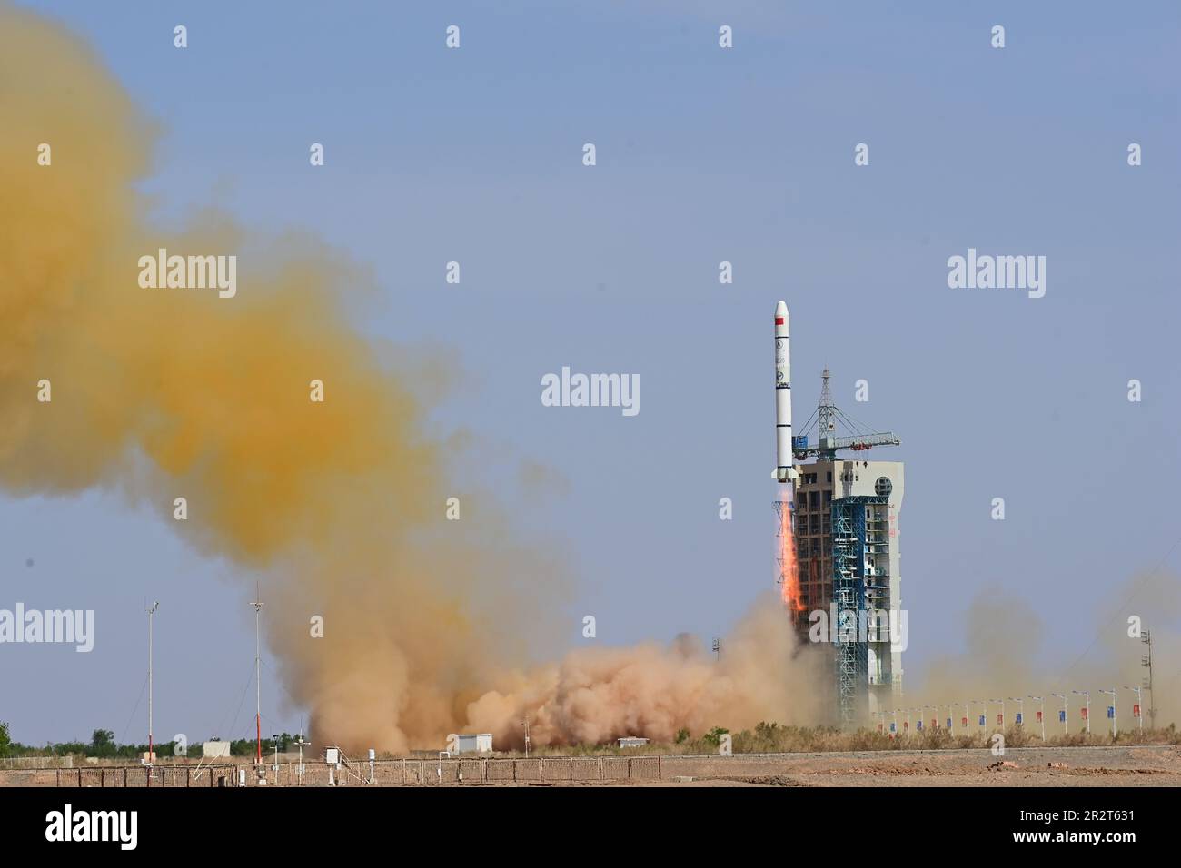 Jiuquan. 21st May, 2023. A Long March-2C carrier rocket blasts off from ...