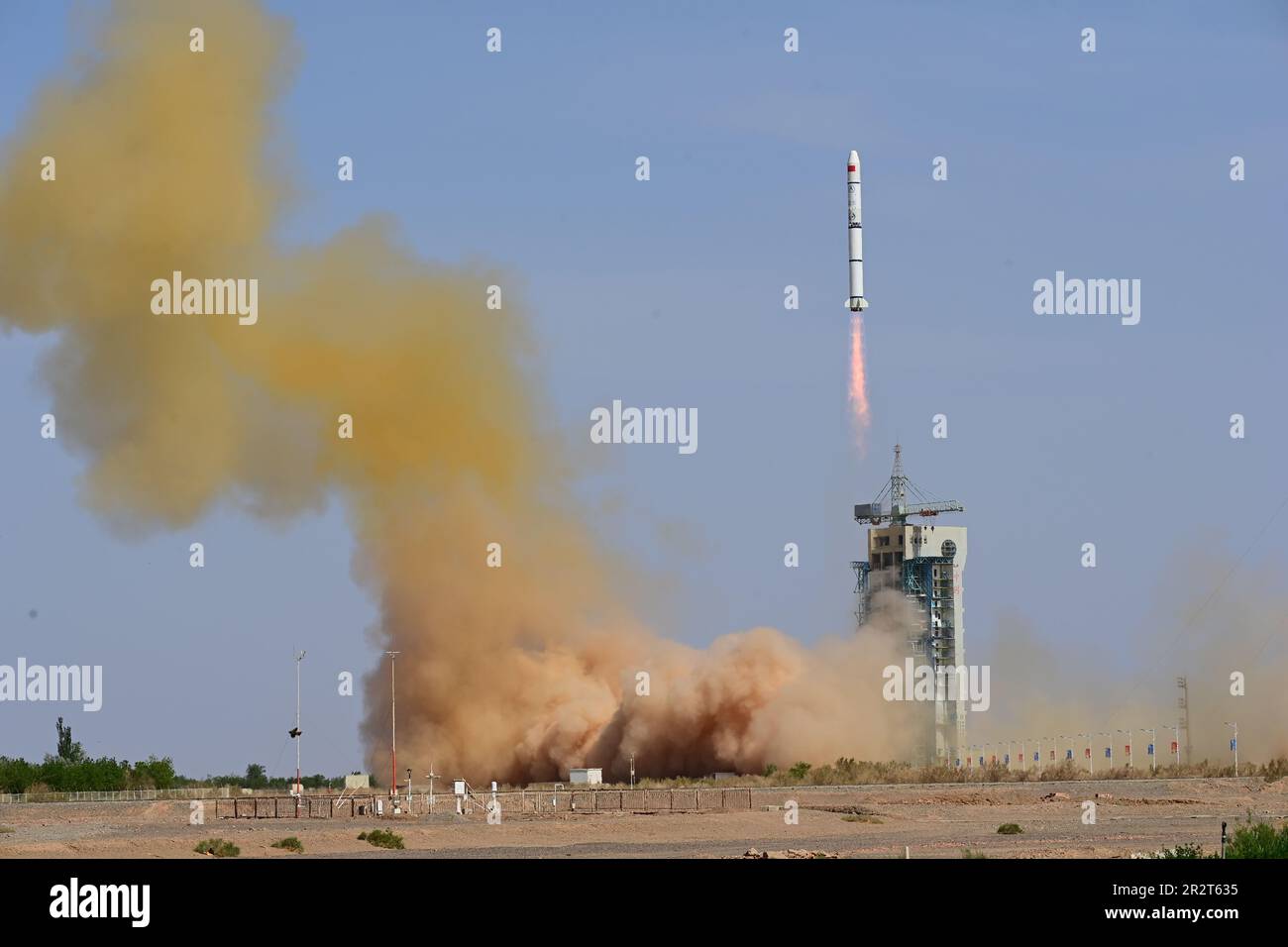 Jiuquan. 21st May, 2023. A Long March-2C carrier rocket blasts off from ...