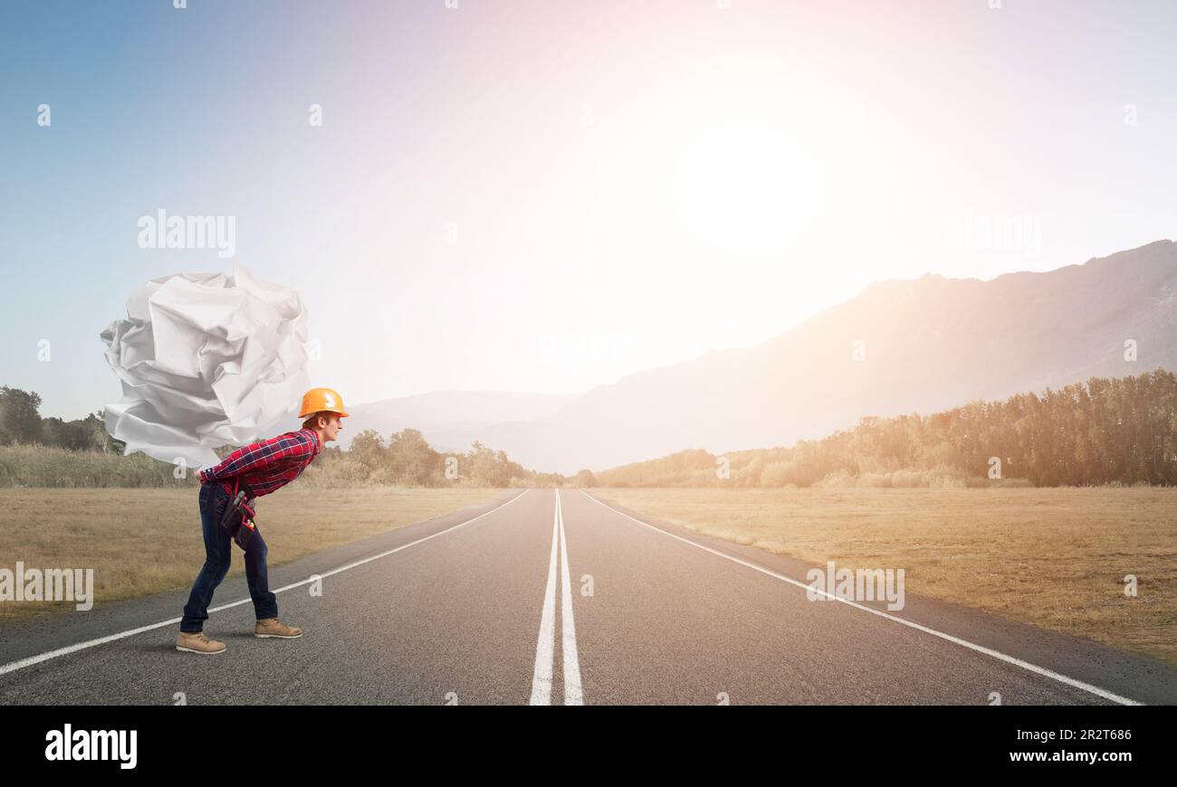 Engineer man carry load Stock Photo - Alamy