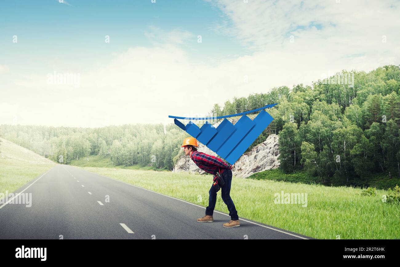 Engineer man carry progress graph Stock Photo - Alamy