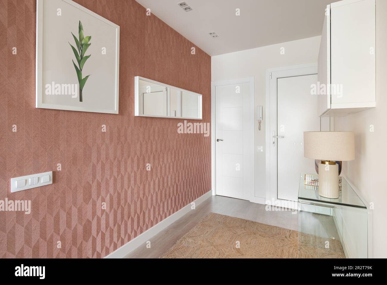 Modern stylish entrance hall with glass console and mirror and ...