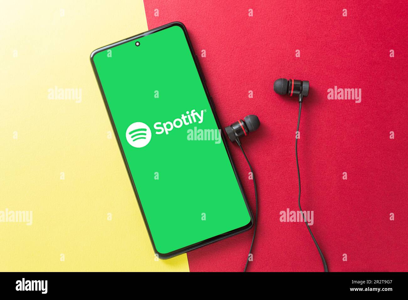 Warsaw, Poland - May 14, 2023: Wireless headphones and phone, Spotify ...