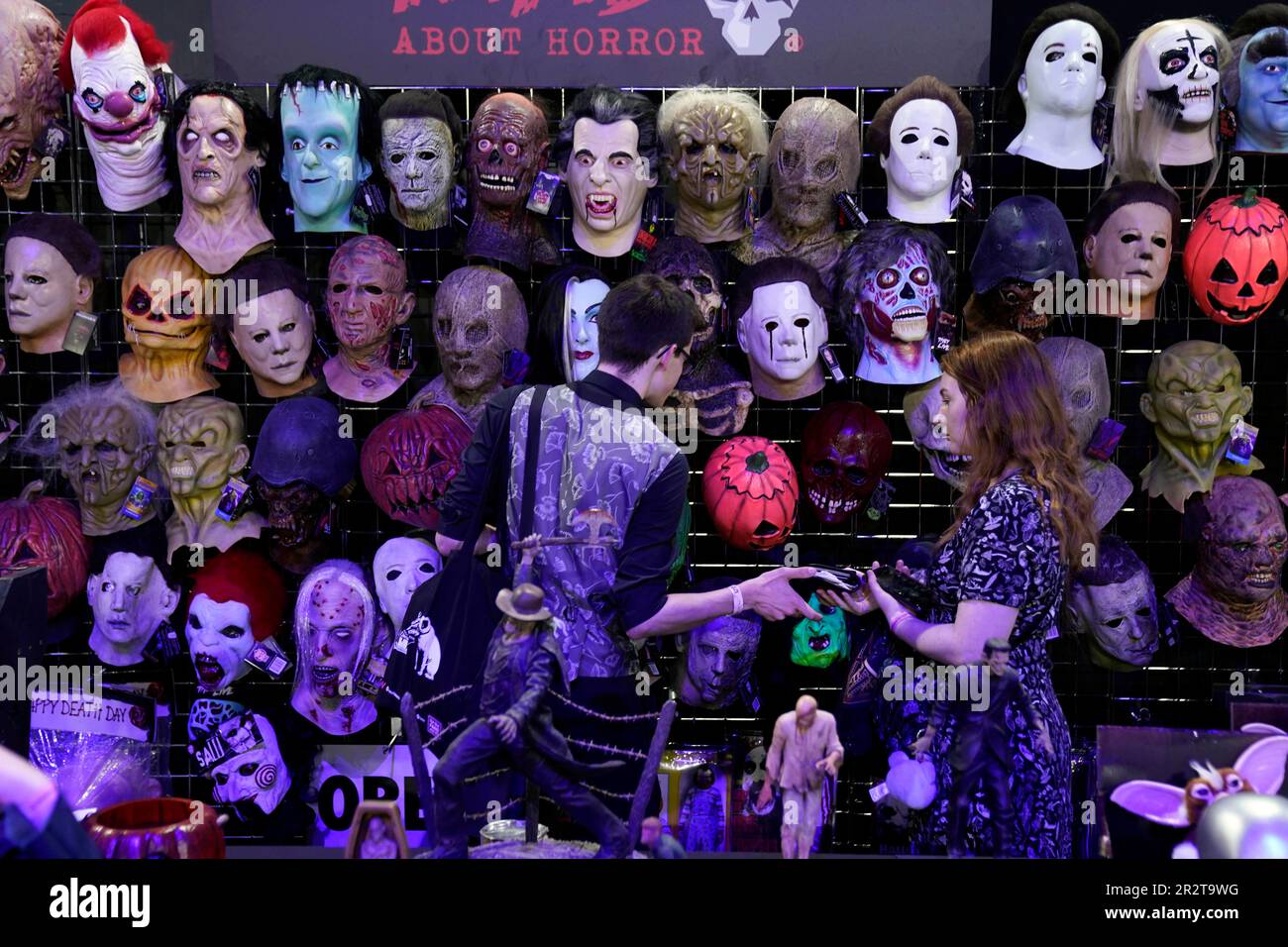 Members of the public look at horror masks during HorrorconUK at the ...