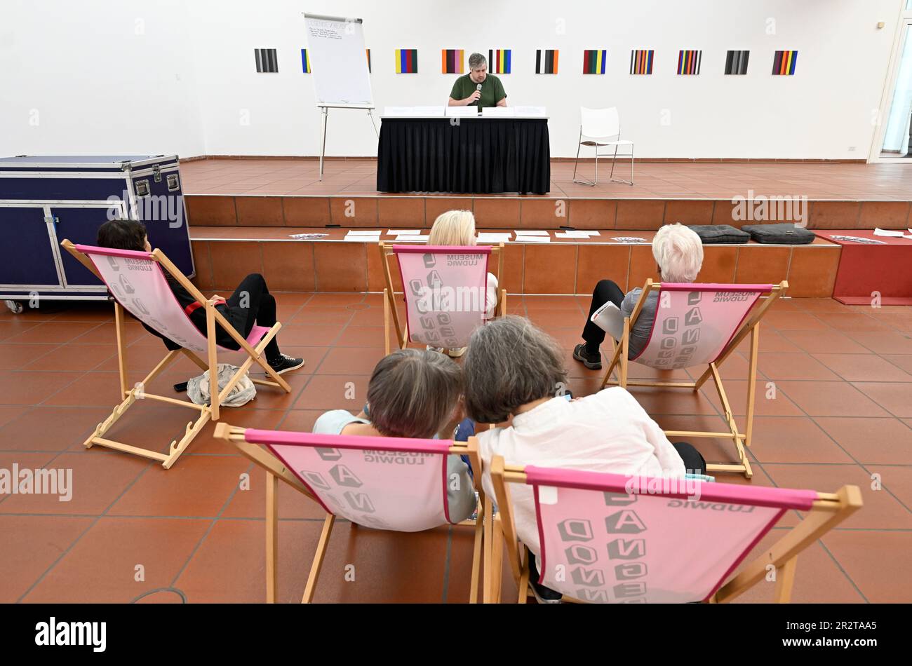 Cologne, Germany. 21st May, 2023. Daniel Schmitz (background), climate ...
