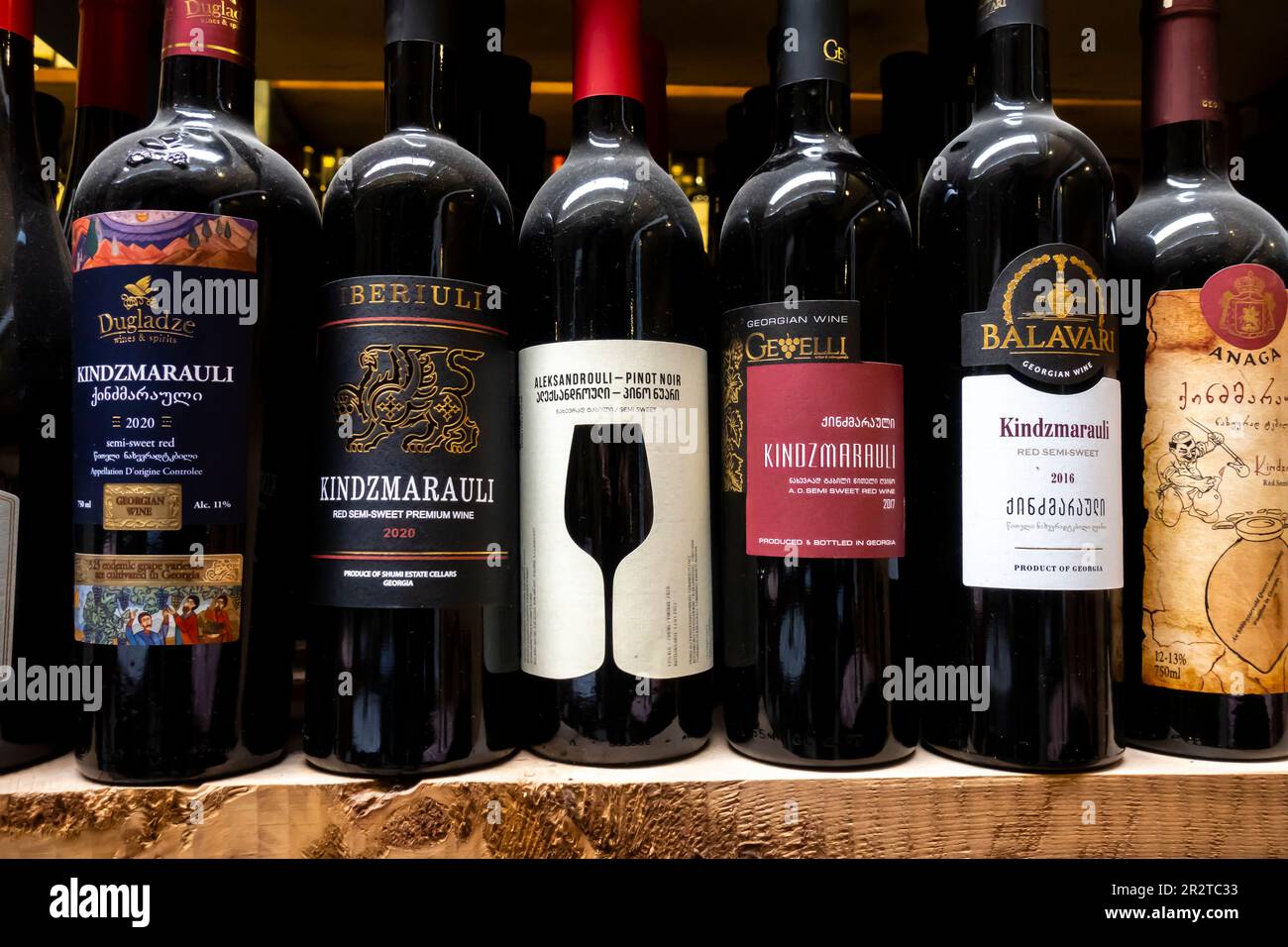 Kindzmarauli wine bottles. Georgian wine on a shelf in a museum and shop of Georgia wine Tbilisi ...