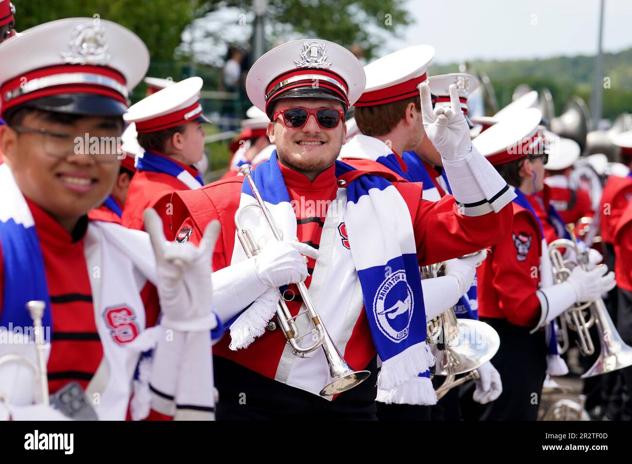 A member of North Carolina State Marching Band poses for a photo ...