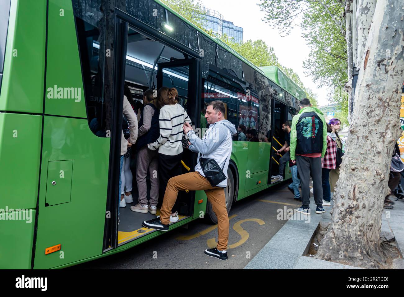 Passengers boarding city bus, Tbilisi Georgia Stock Photo - Alamy