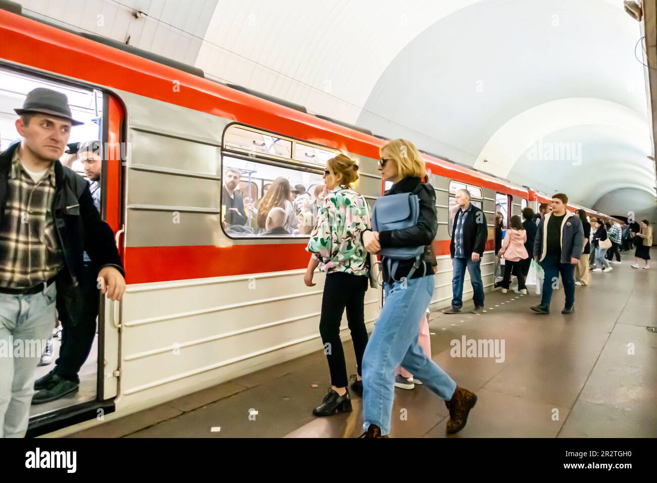 Passengers exiting a metro train in Tbilisi metro. Commuters in subway ...