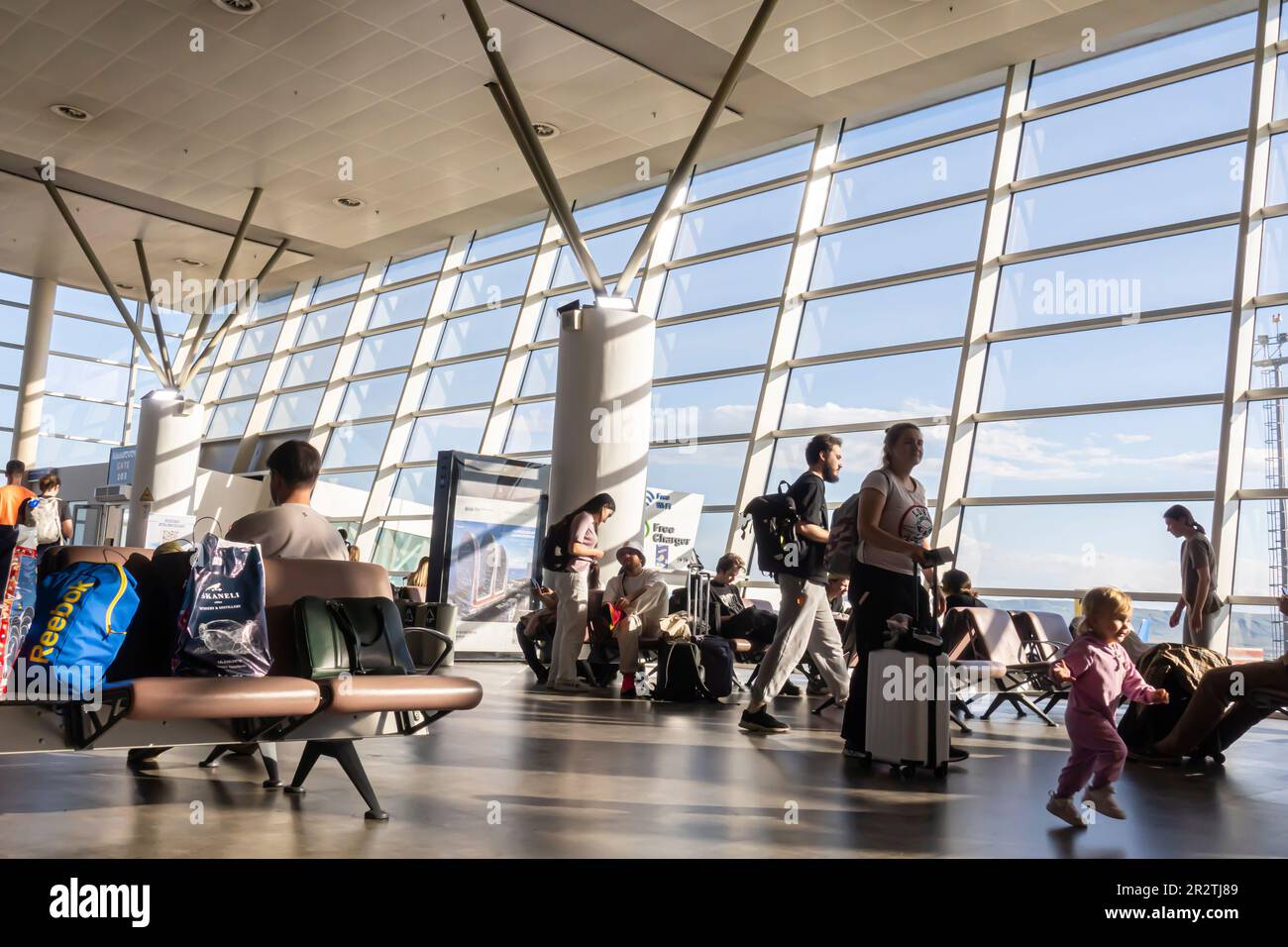 Tbilisi International Airport waiting area,family with a child, TBS ...