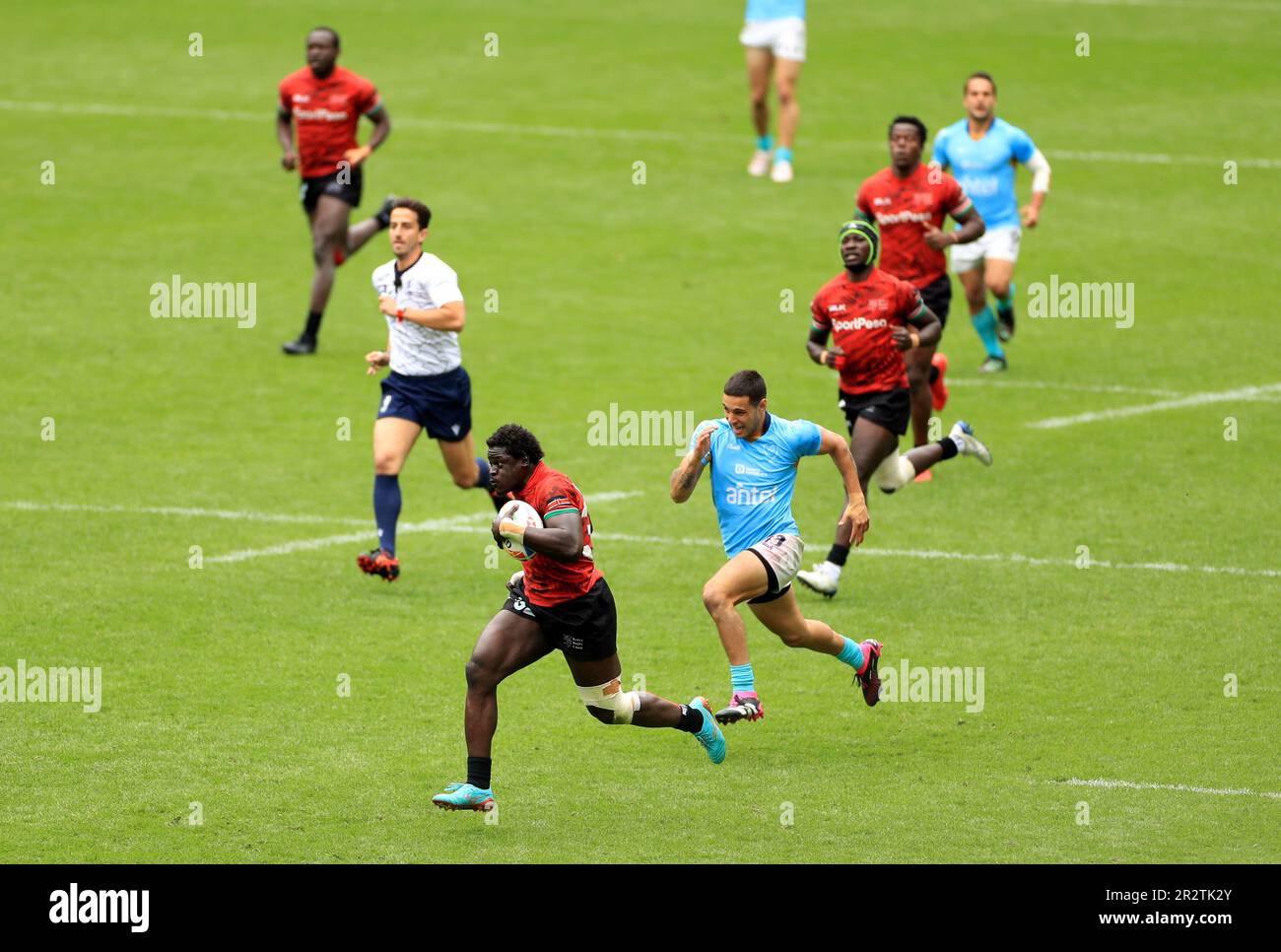 Kenya’s Alvin Otieno breaks through to score a try during game 24 of ...