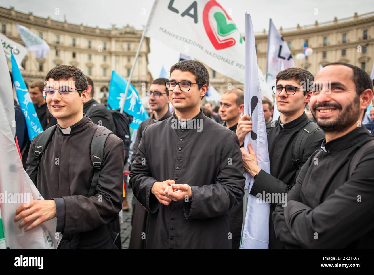 Smiling priests listen to the speeches during the anti-abortion ...