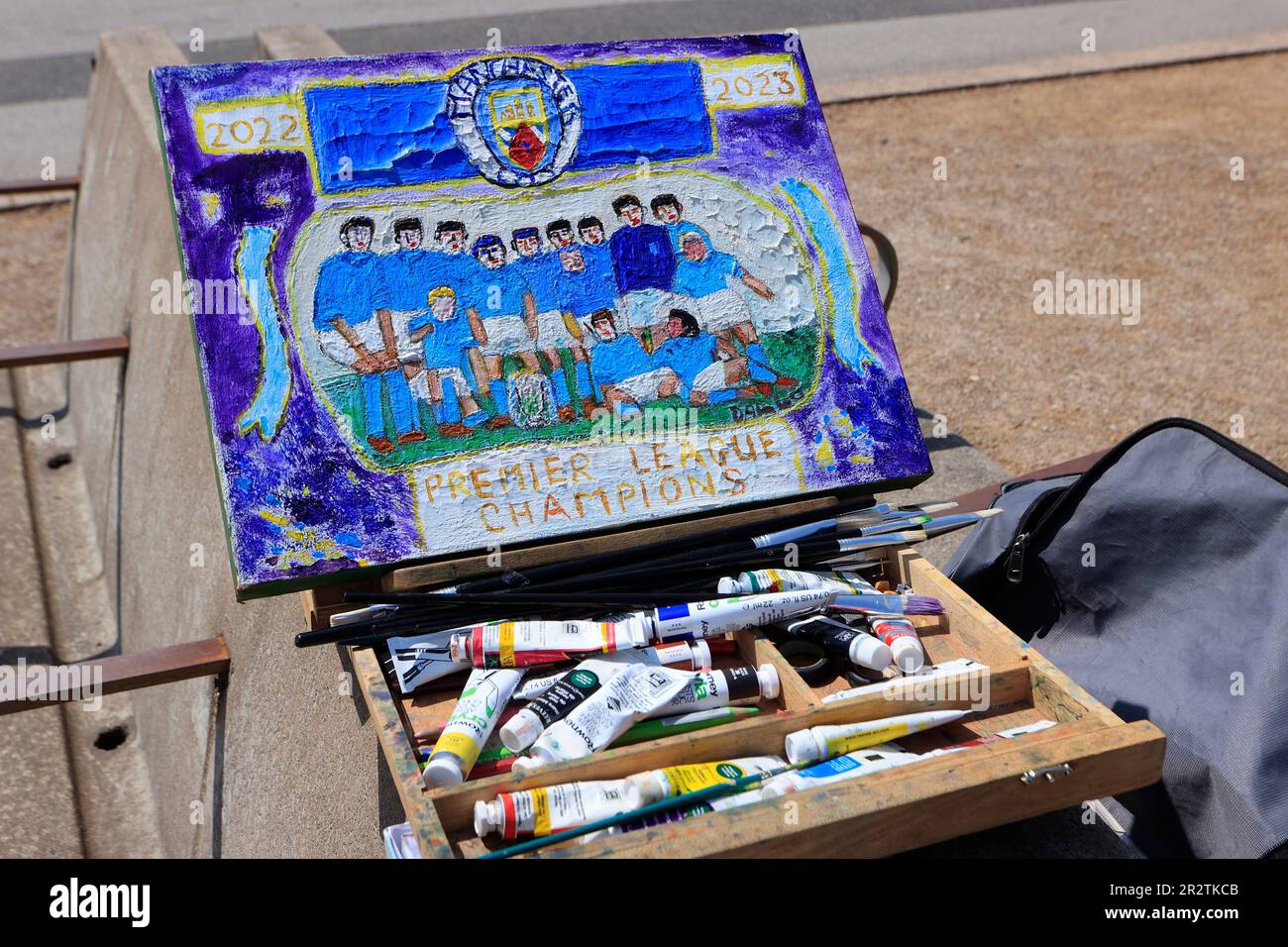 Artist at work outside the Etihad ahead of the Premier League match ...