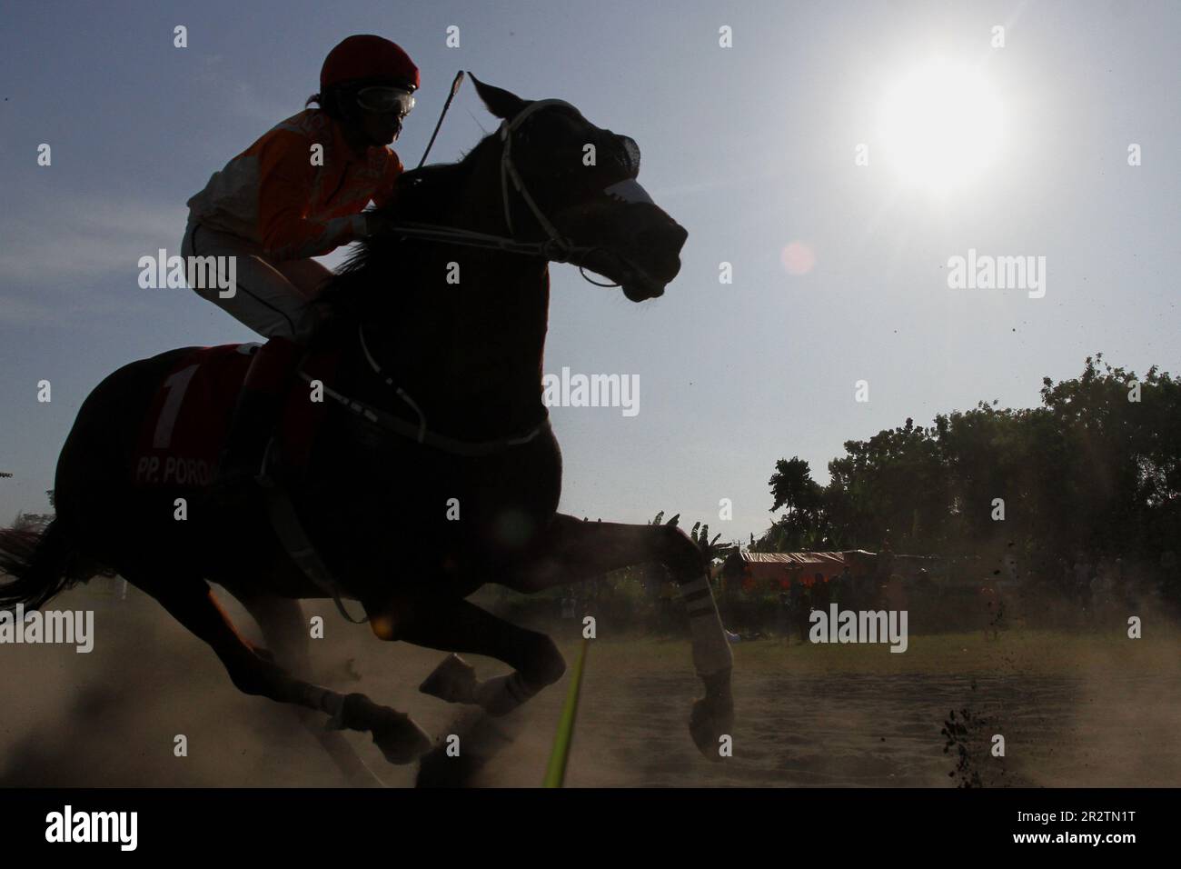 Bantul, Yogyakarta, Indonesia. 21st May, 2023. Jockey spurring his ...