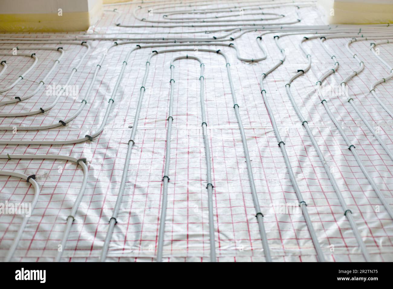 Installation of underfloor heating pipes for water heating. Heating systems. Pipes for ...