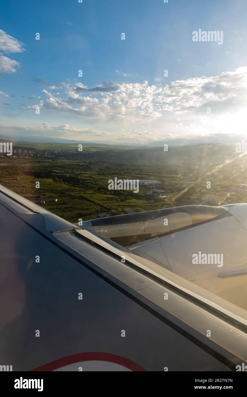 Caucasus Georgia sun beam sun beaming into the window of aeroplane ...