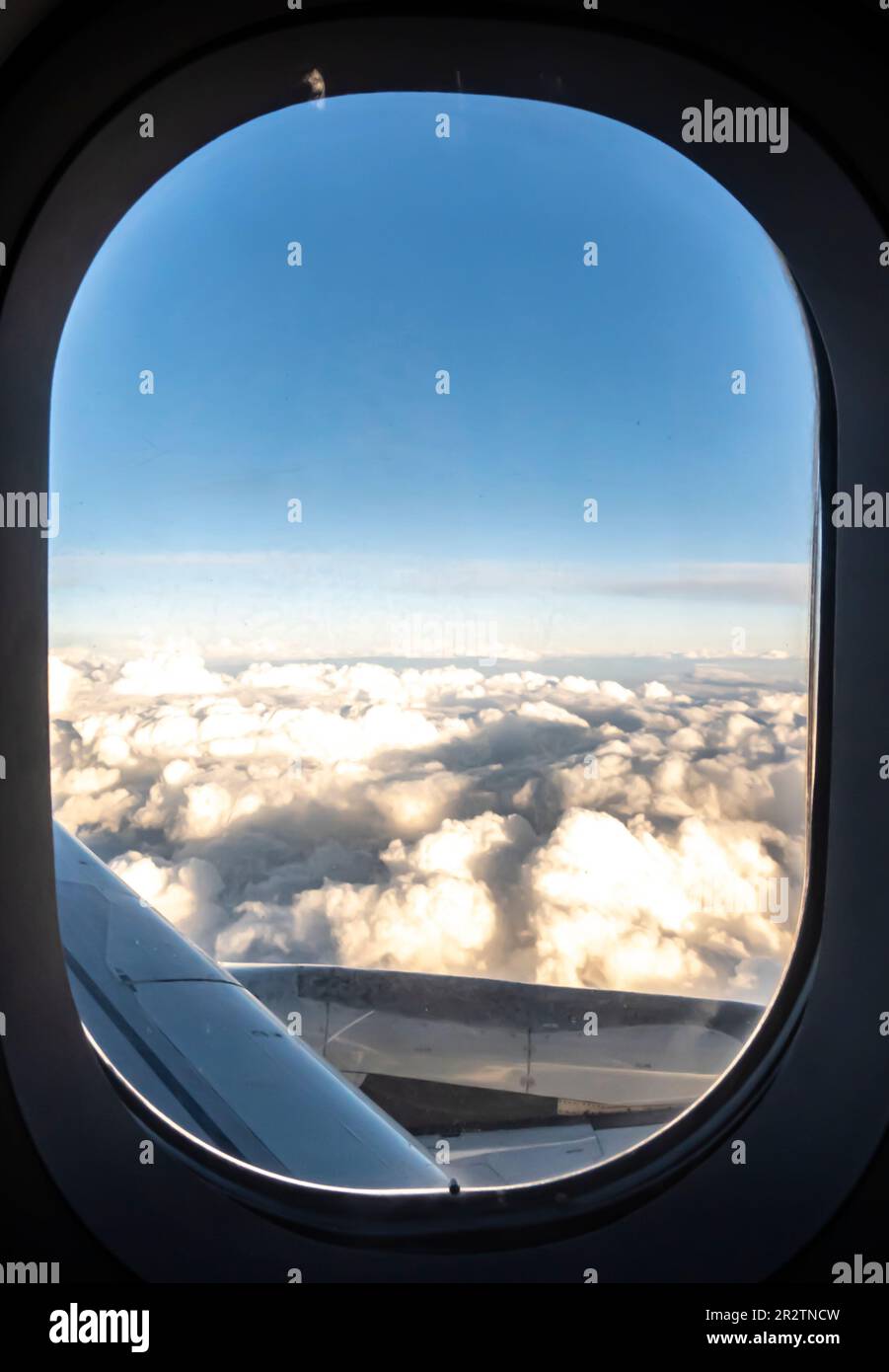 Clouds seen through the jet engine - aerial view from an airplane ...